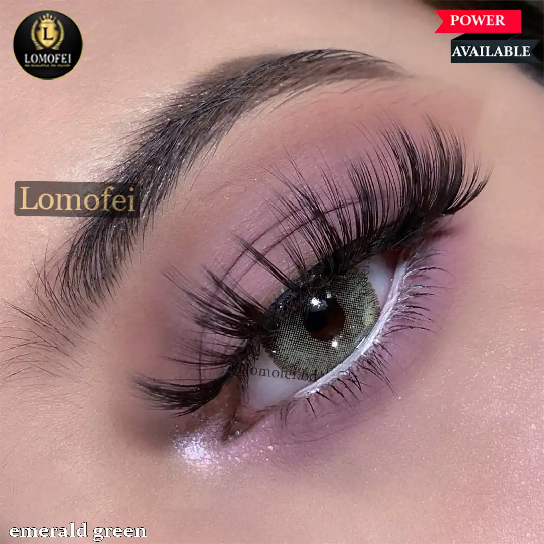 A model wearing Bella Elite Emerald Green Fashion Contact Lense, close ...